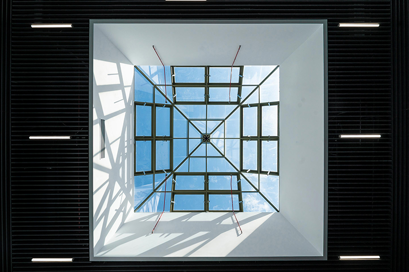 Semi-Transparent Yellow Metal Arches Redefine the North-Side Extension ...